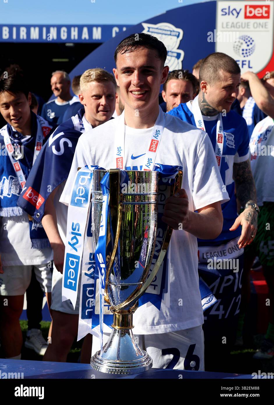 Birmingham City's Luke Harris with the Sky Bet League One trophy after ...