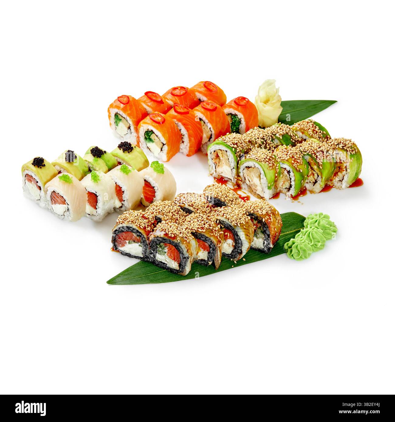 Variety of sushi rolls with different toppings presented on banana ...