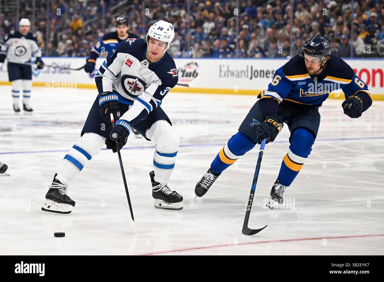 Winnipeg Jets' Morgan Barron, left, controls the puck as St. Louis ...