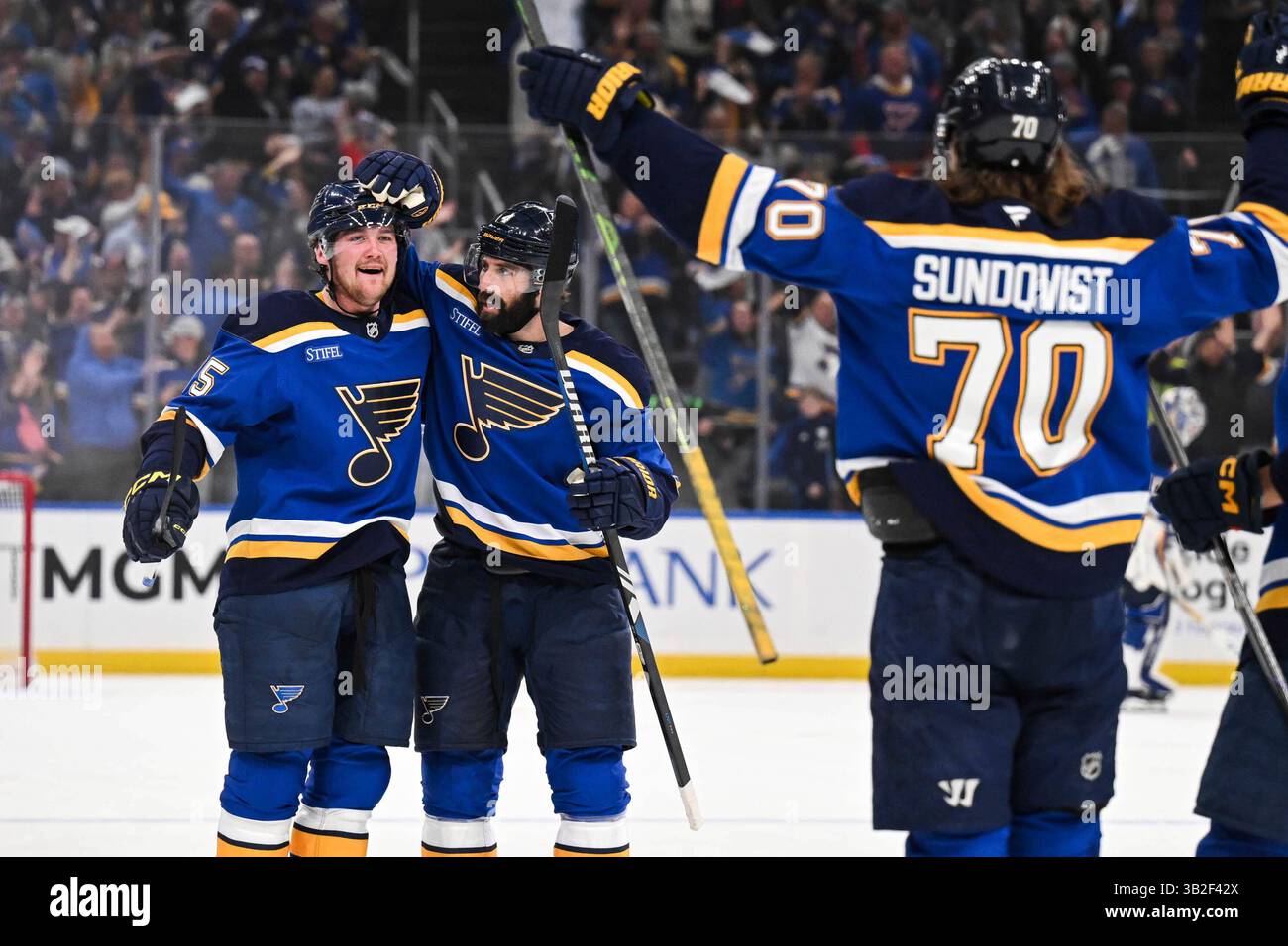 St. Louis Blues' Tyler Tucker, left, celebrates with teammates after ...