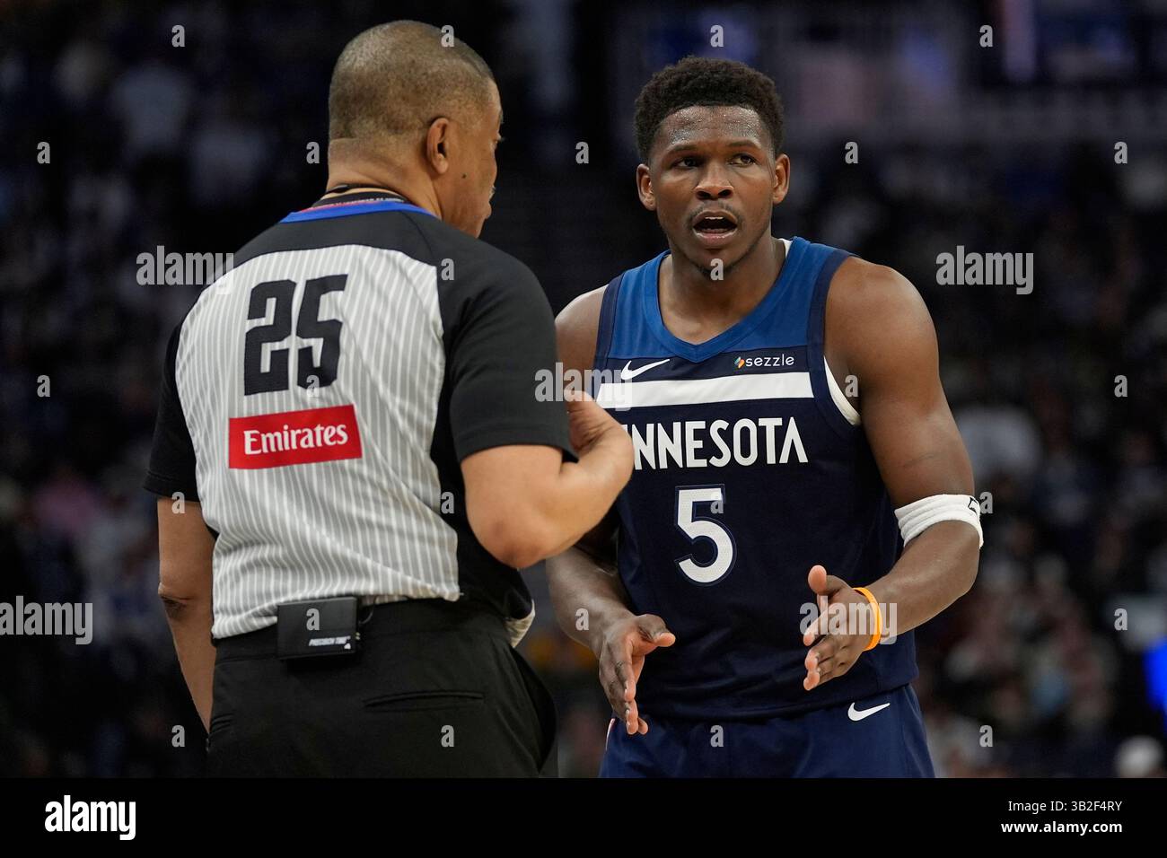 Minnesota Timberwolves guard Anthony Edwards (5) talks with referee Tony Brothers during the ...