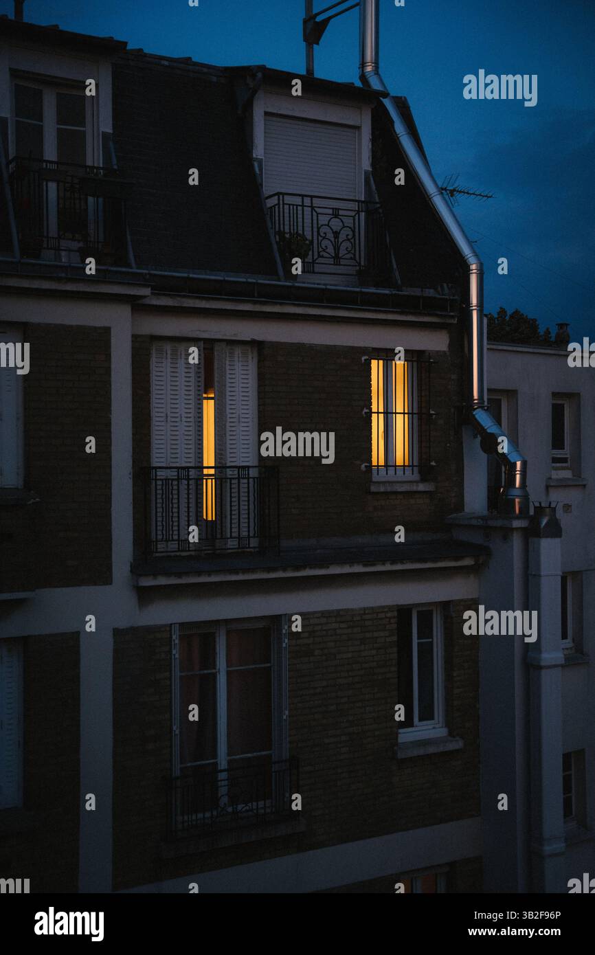 Dusk City Glow – Illuminated Windows on Urban Facades Stock Photo - Alamy