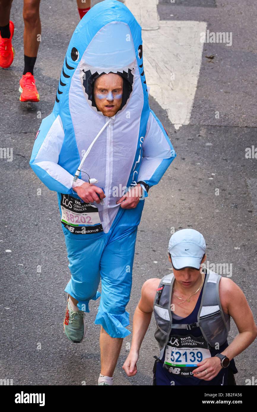 London, UK. 27th Apr, 2025. A runner in shark costume. The main field ...