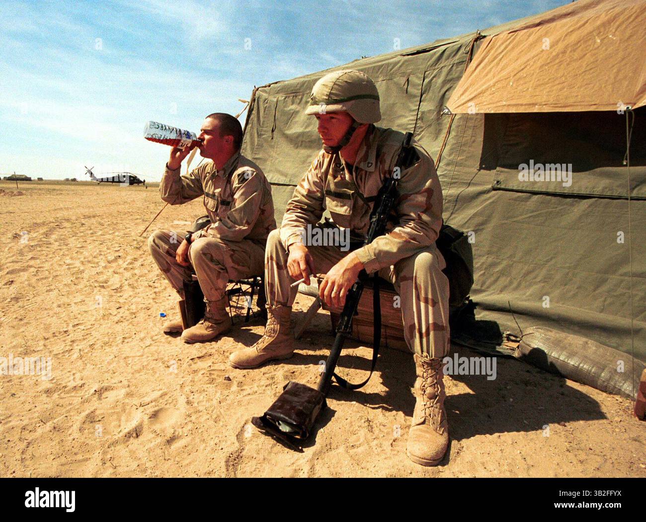 Feb 19, 1991; Camp Doha, Kuwait; 2 US Army soldiers enjoy a bit of a ...
