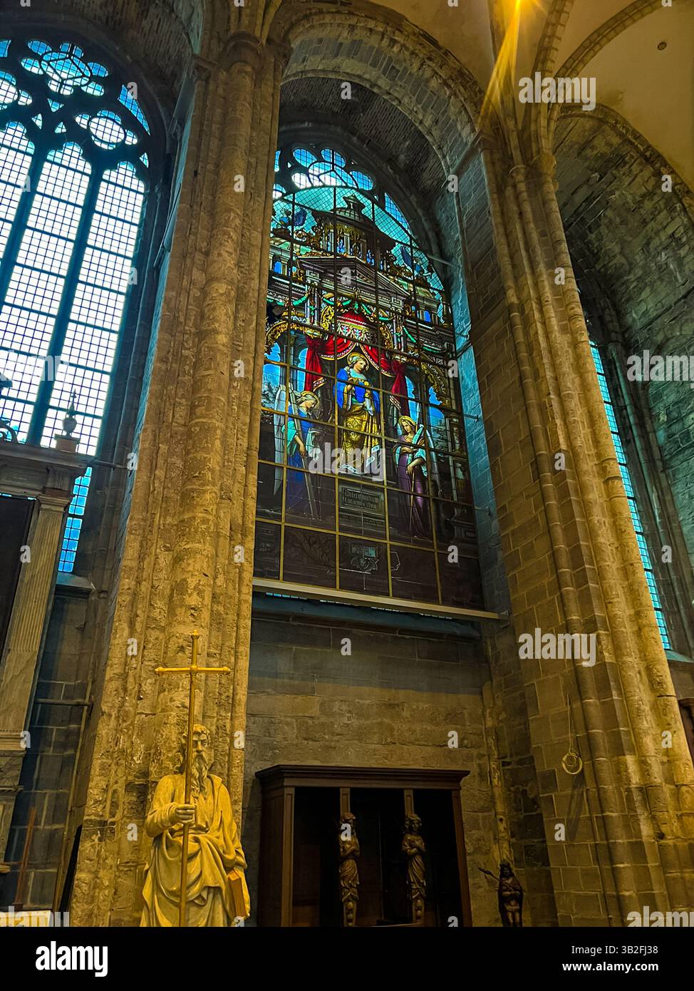 Stunning interior of Ghent cathedral showcasing stained glass windows ...