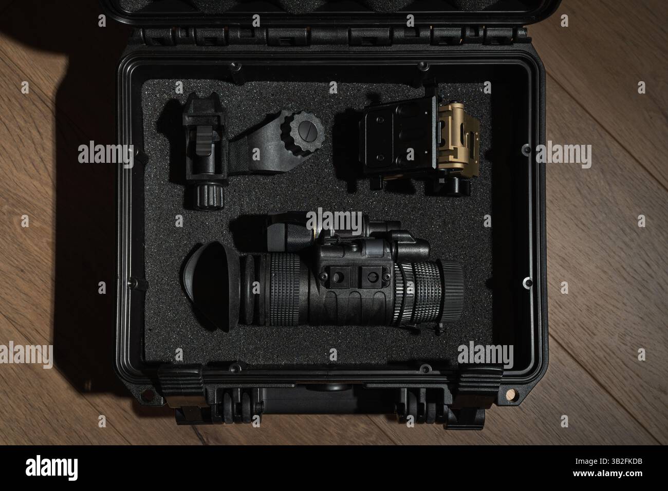 Modern military night vision kit and accessories presented in a ...