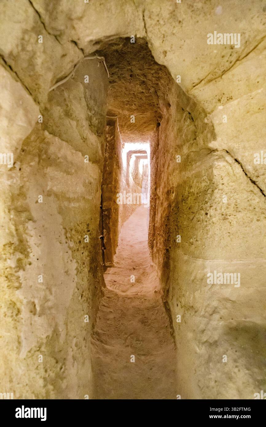 interior of an ancient underground cave city, narrow passage Stock ...