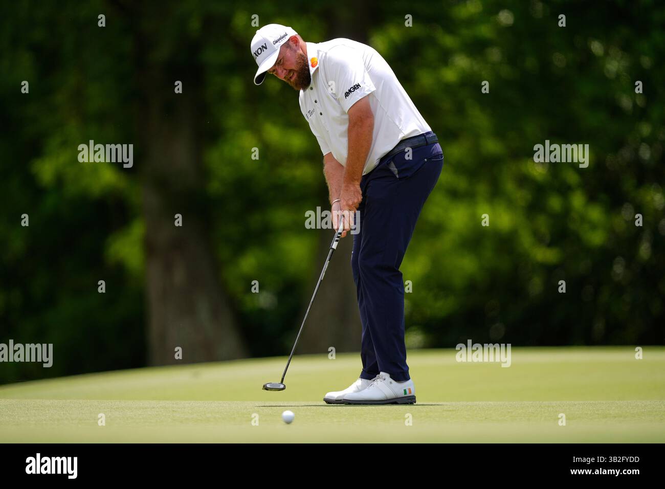 Shane Lowry, of Ireland, lines up putts on the second green during the final round of the PGA ...