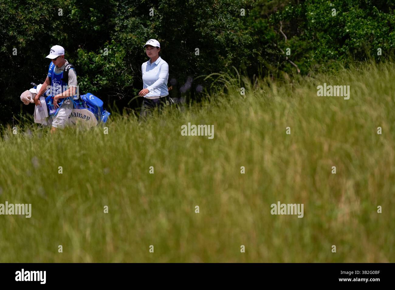 Yan Liu, of China, walks on the nineth hole during the final round of ...