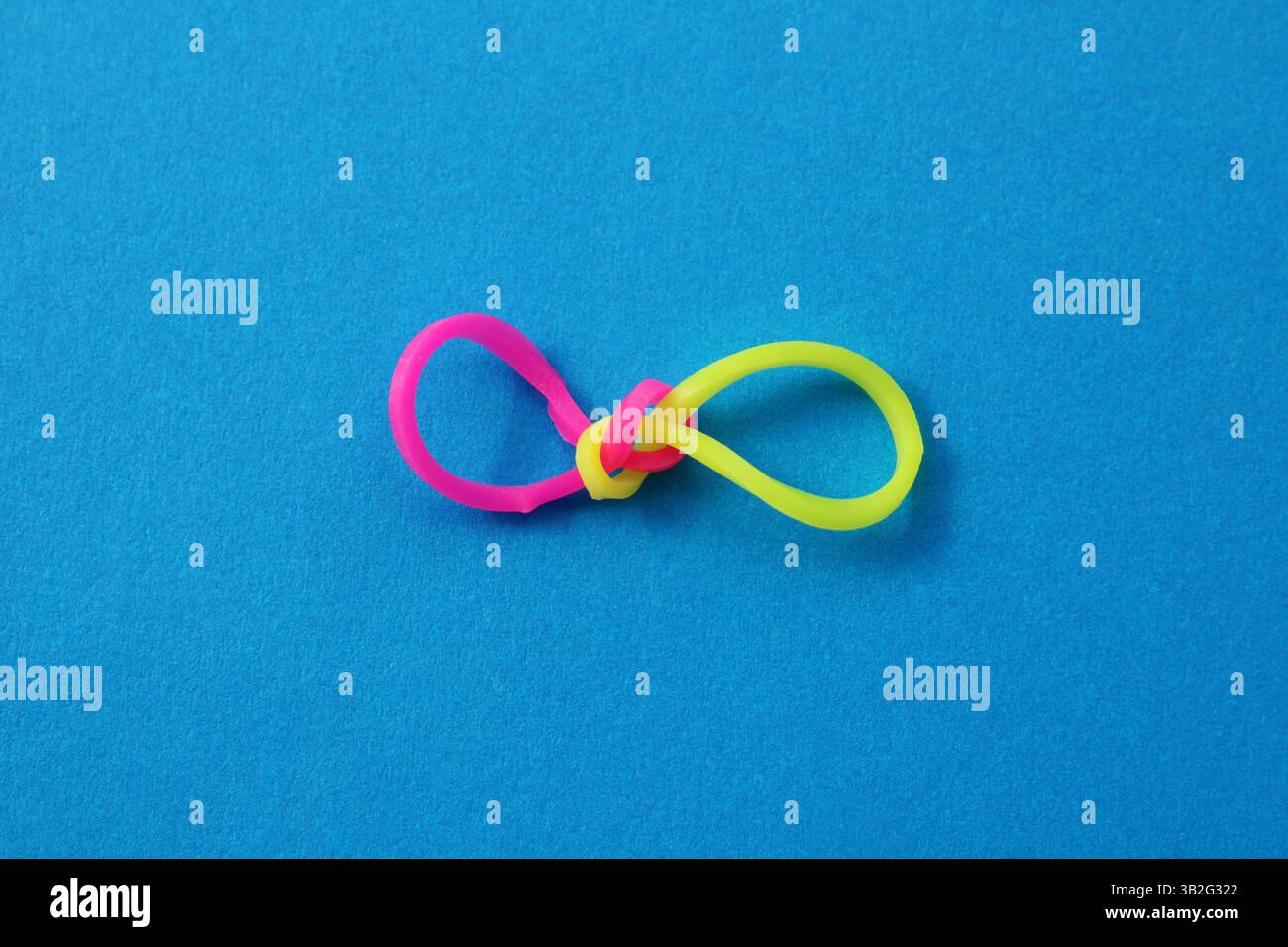 Rubber bands tied together by a knot Stock Photo - Alamy
