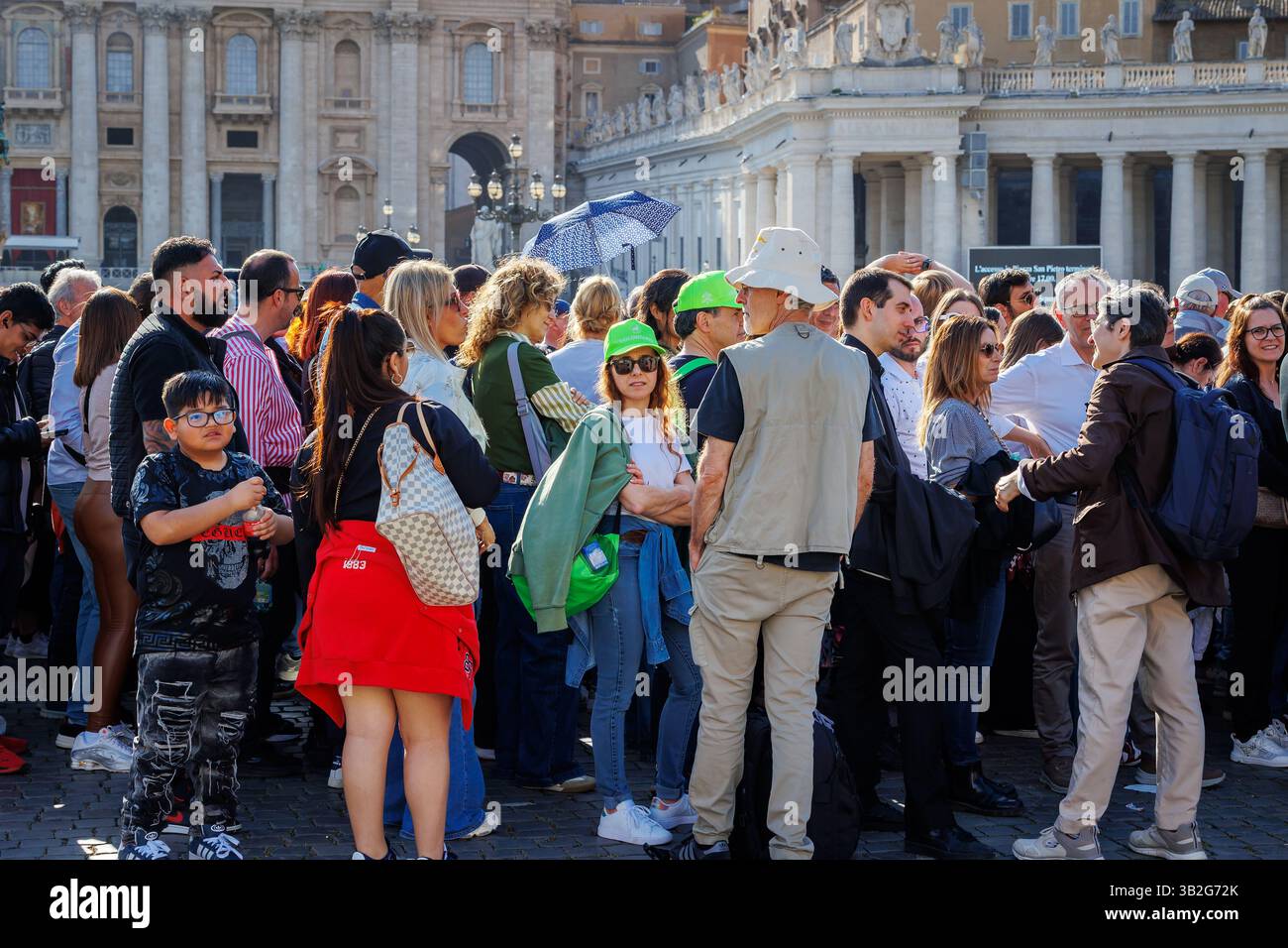 Vatican City, Vatican - April 25, 2025: Faithful line up to enter St ...
