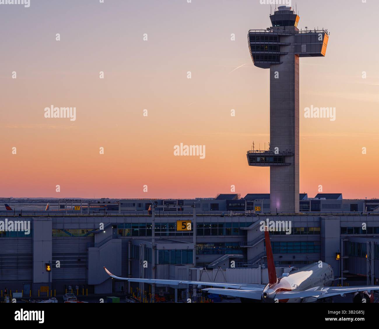 Air traffic control tower at JFK Airport, New York City, during a ...