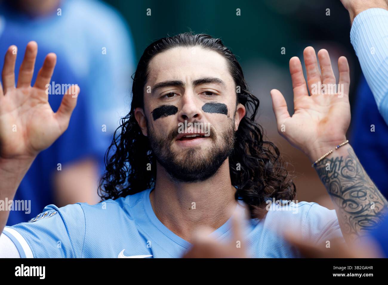 Kansas City Royals' Jonathan India celebrates in the dugout after ...