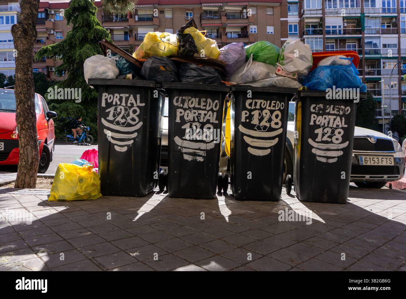 Madrid, Spain. 27th Apr, 2025. Several bins overflowing with garbage on ...