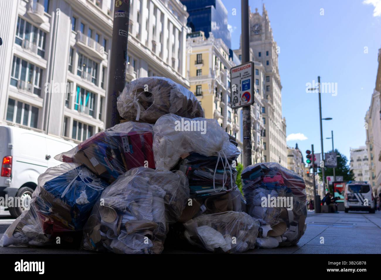 Madrid, Spain. 27th Apr, 2025. Several garbage bags are piled up on a ...