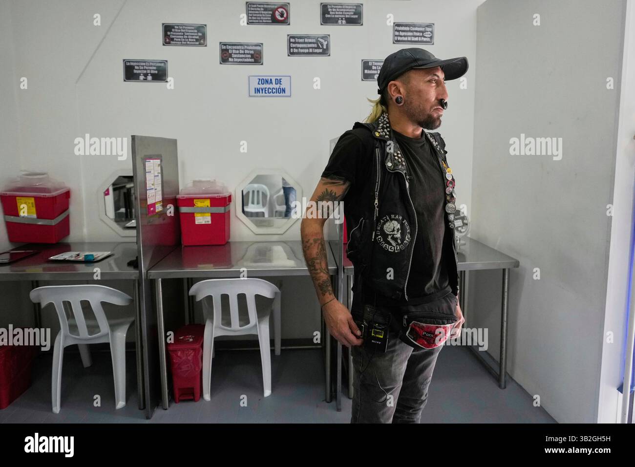 Christian Amaya, a drug user, looks out the window of the Cambie ...