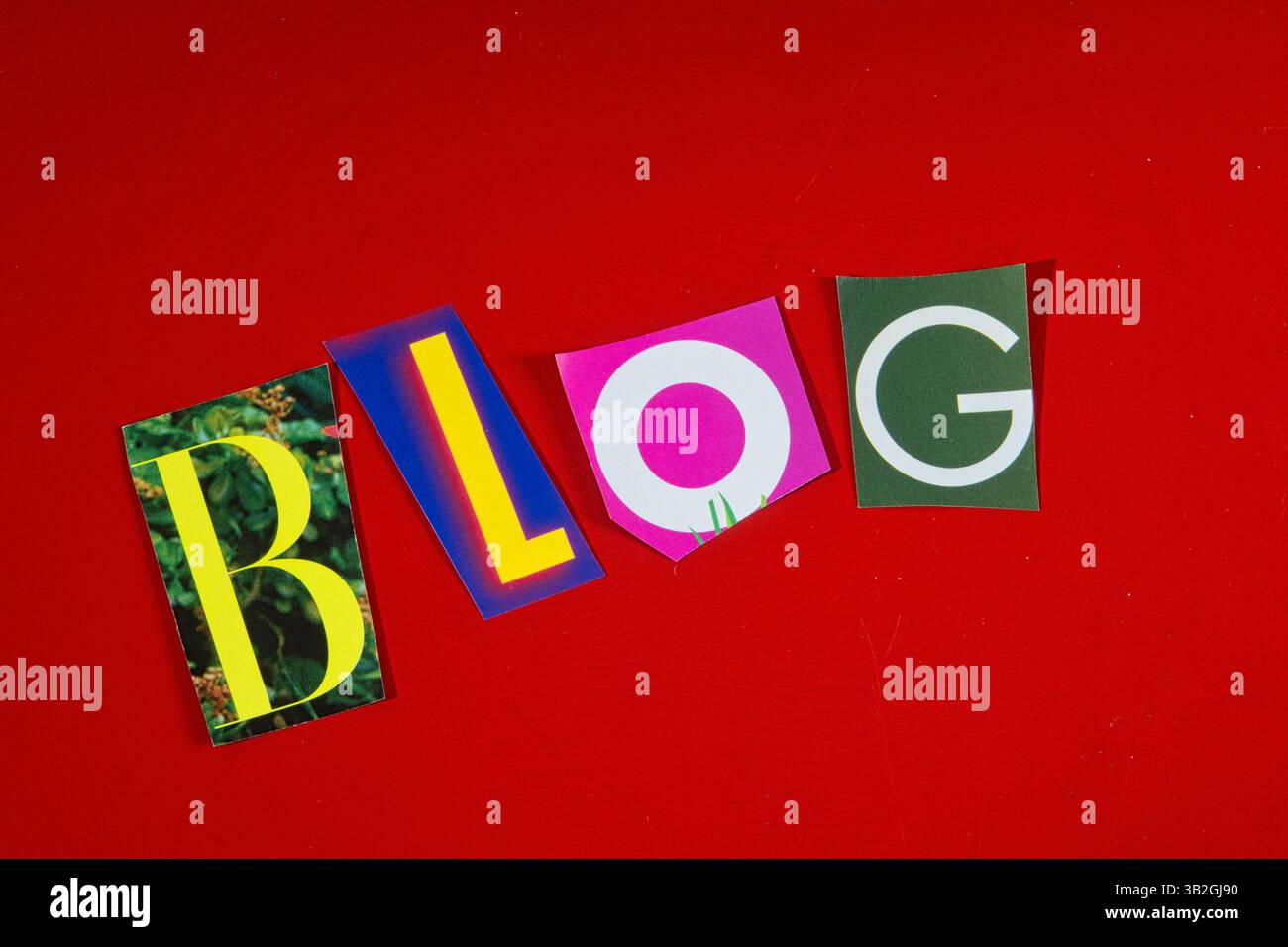 The Word "Blog" using cut-out paper letters in the ransom note effect ...