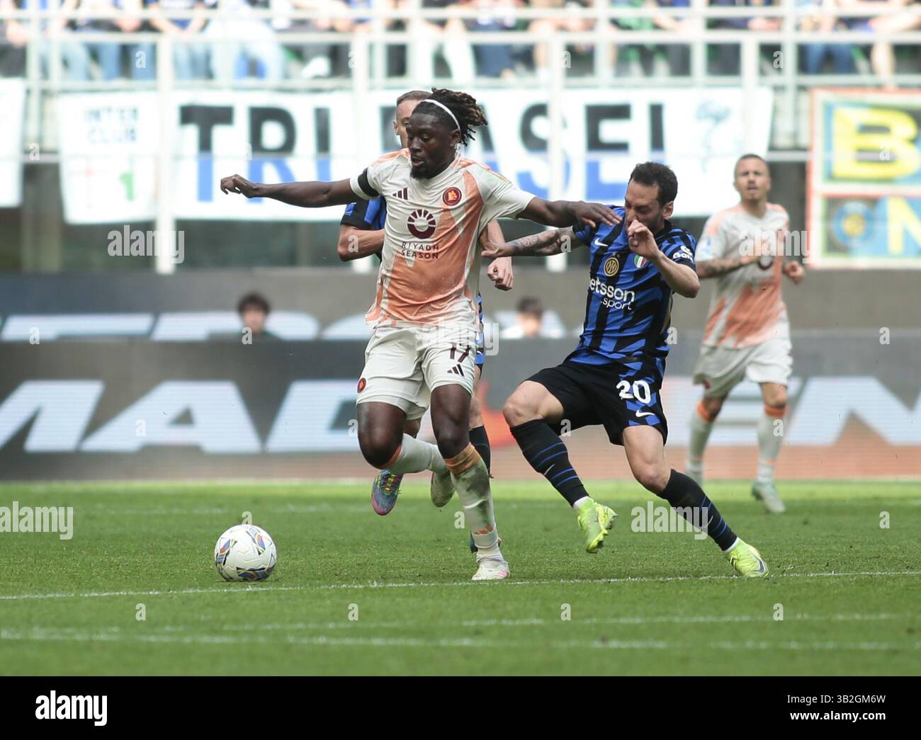Kouadio Kone of AS Roma and Hakan Calhanoglu of Inter FC during the ...