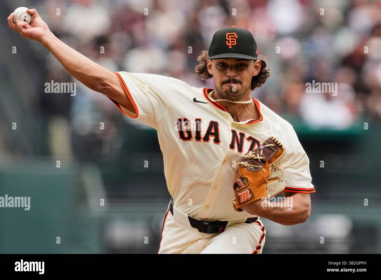 San Francisco Giants' Jordan Hicks pitches to a Texas Rangers batter ...
