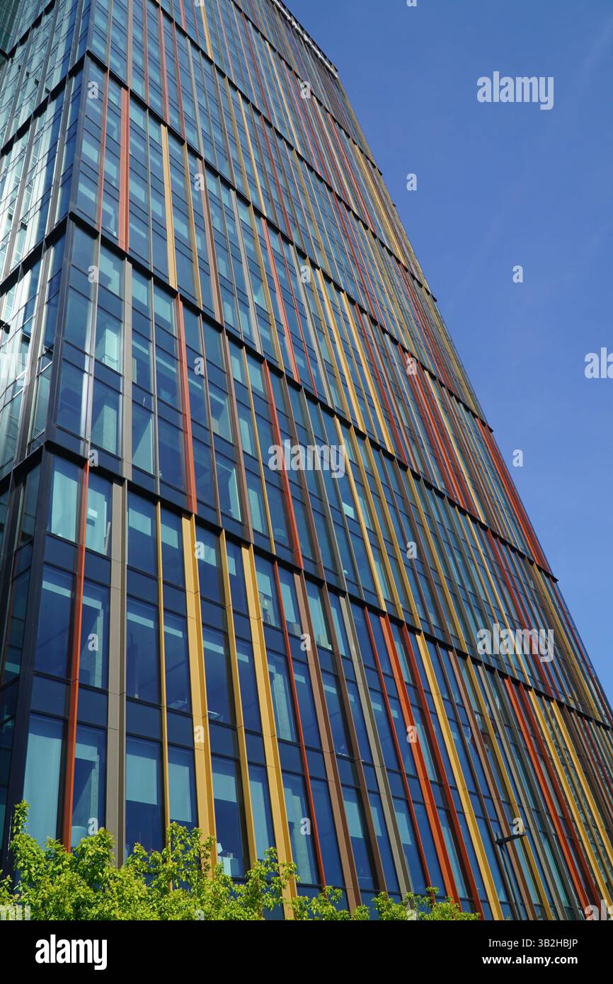 Modern office building exterior with glass and steel facade on clear ...