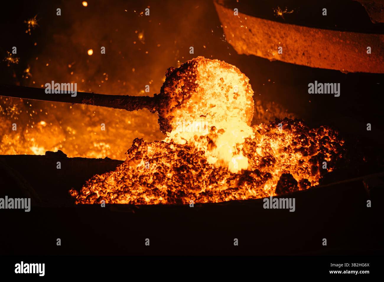 Removing slag from surface of hot iron in melting furnace Stock Photo ...