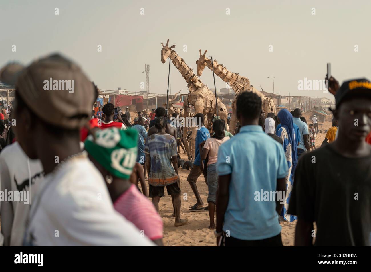 Puppeteers move cardboard animals at the Malibu beach in Dakar, Senegal ...