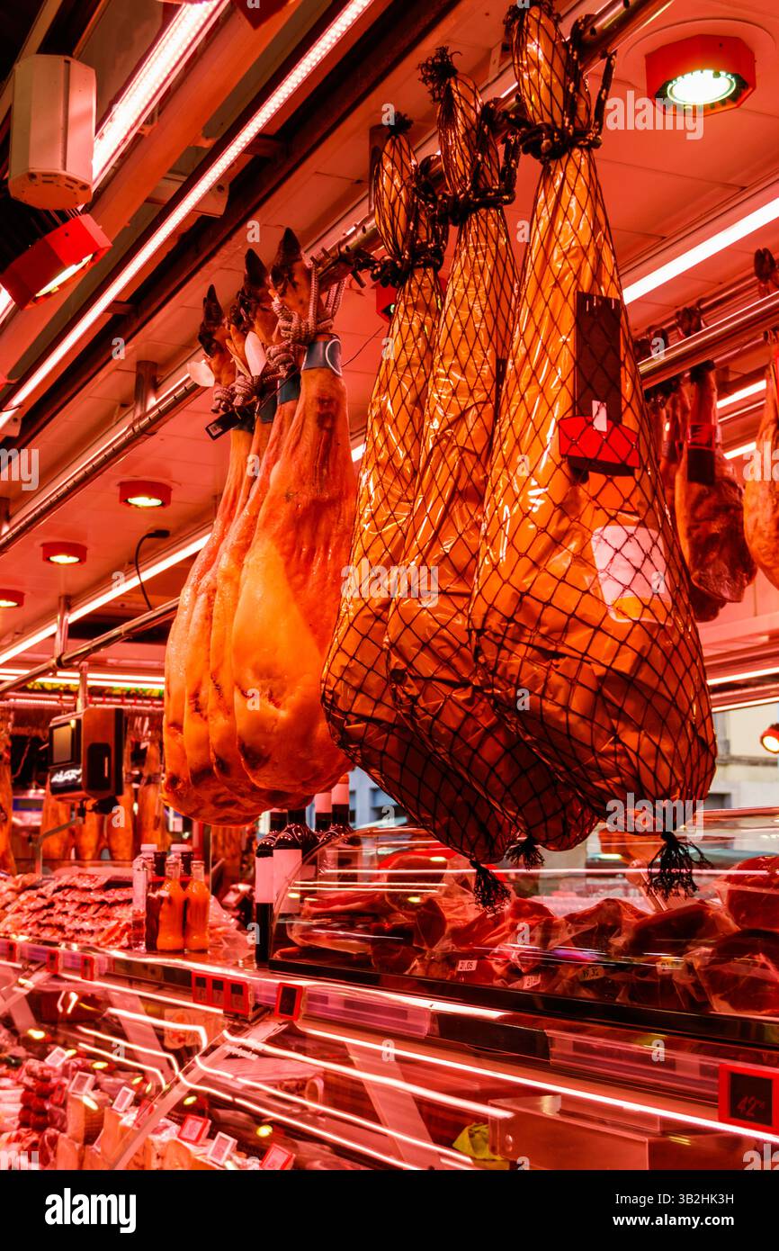 Jamon serrano ham legs hanging in a traditional spanish market Stock ...