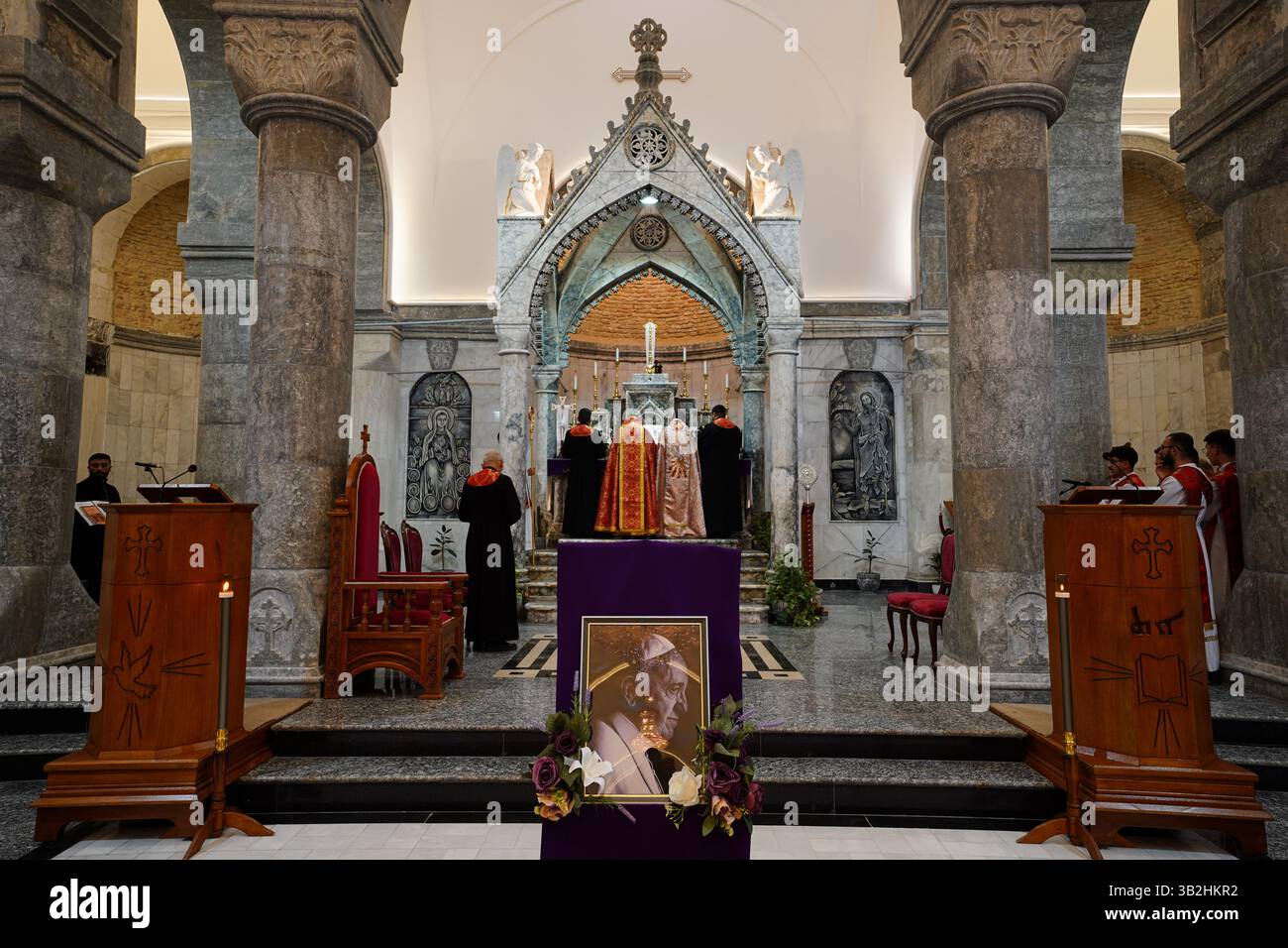 Al Hamdaniya, Iraq. 27th Apr, 2025. The portrait of Pope Francis is ...