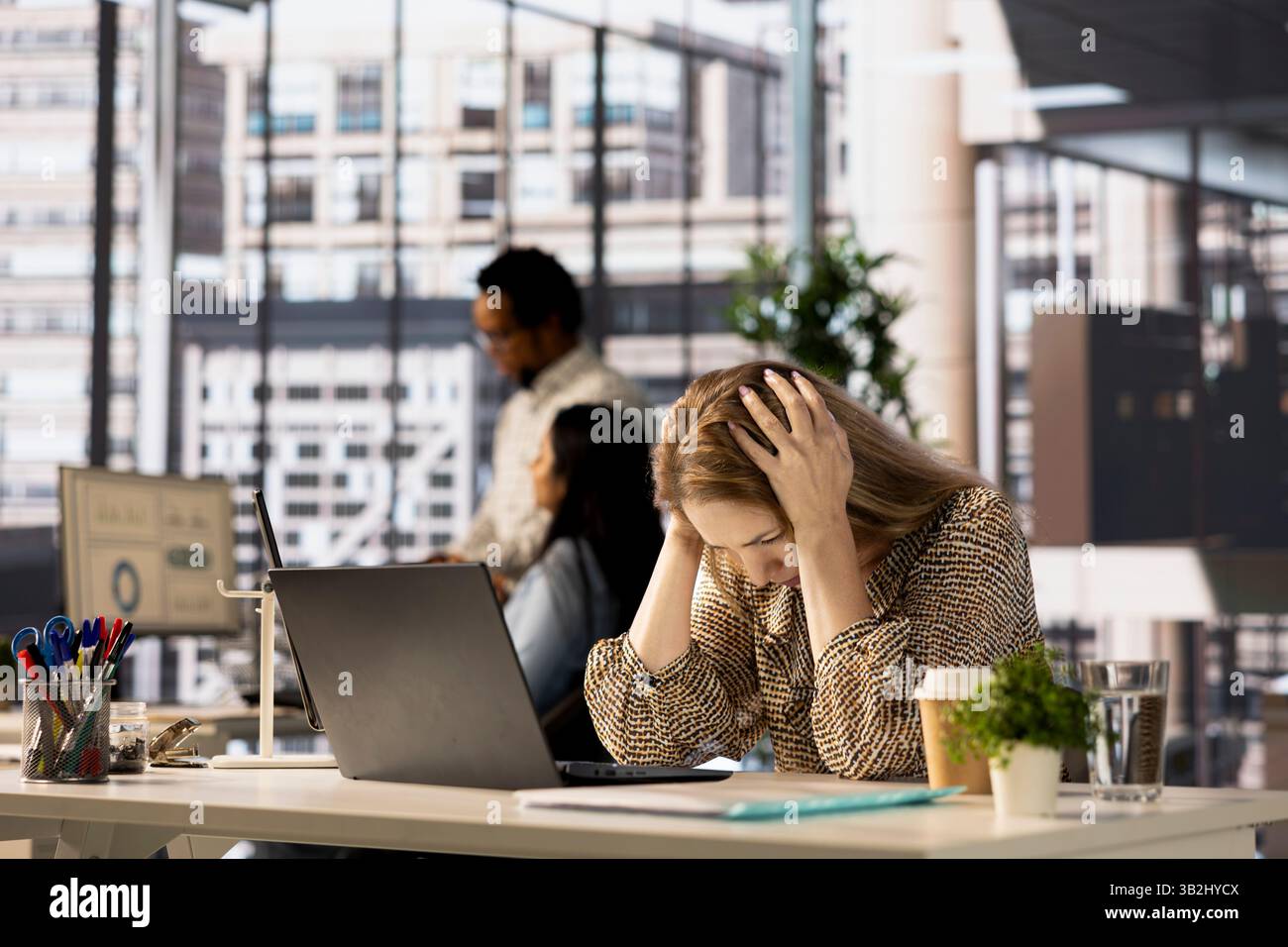 Stressed businesswoman faces a migraine from corporate pressure ...