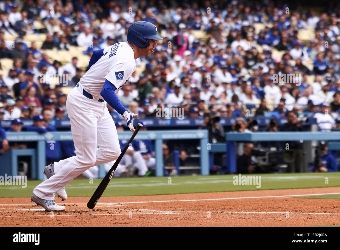 Los Angeles Dodgers' Freddie Freeman drops his bat after hitting an RBI ...