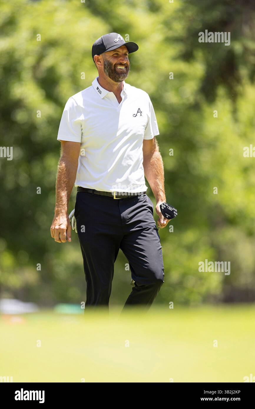 Captain Dustin Johnson of 4Aces GC reacts to his putt on the eighth ...
