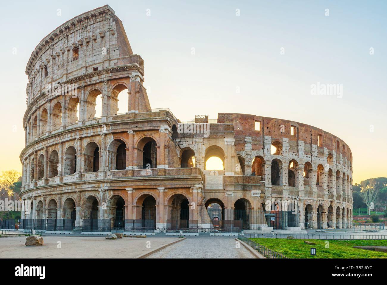 Ancient Colosseum Amphitheater in Rome city, Italy illuminated by soft ...