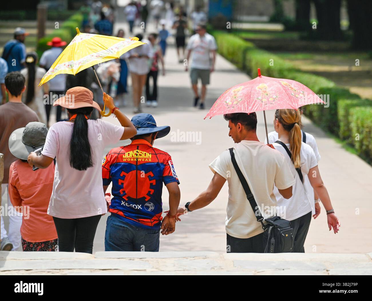 NEW DELHI, INDIA - APRIL 26: Visitors brave the heat wave during a hot ...