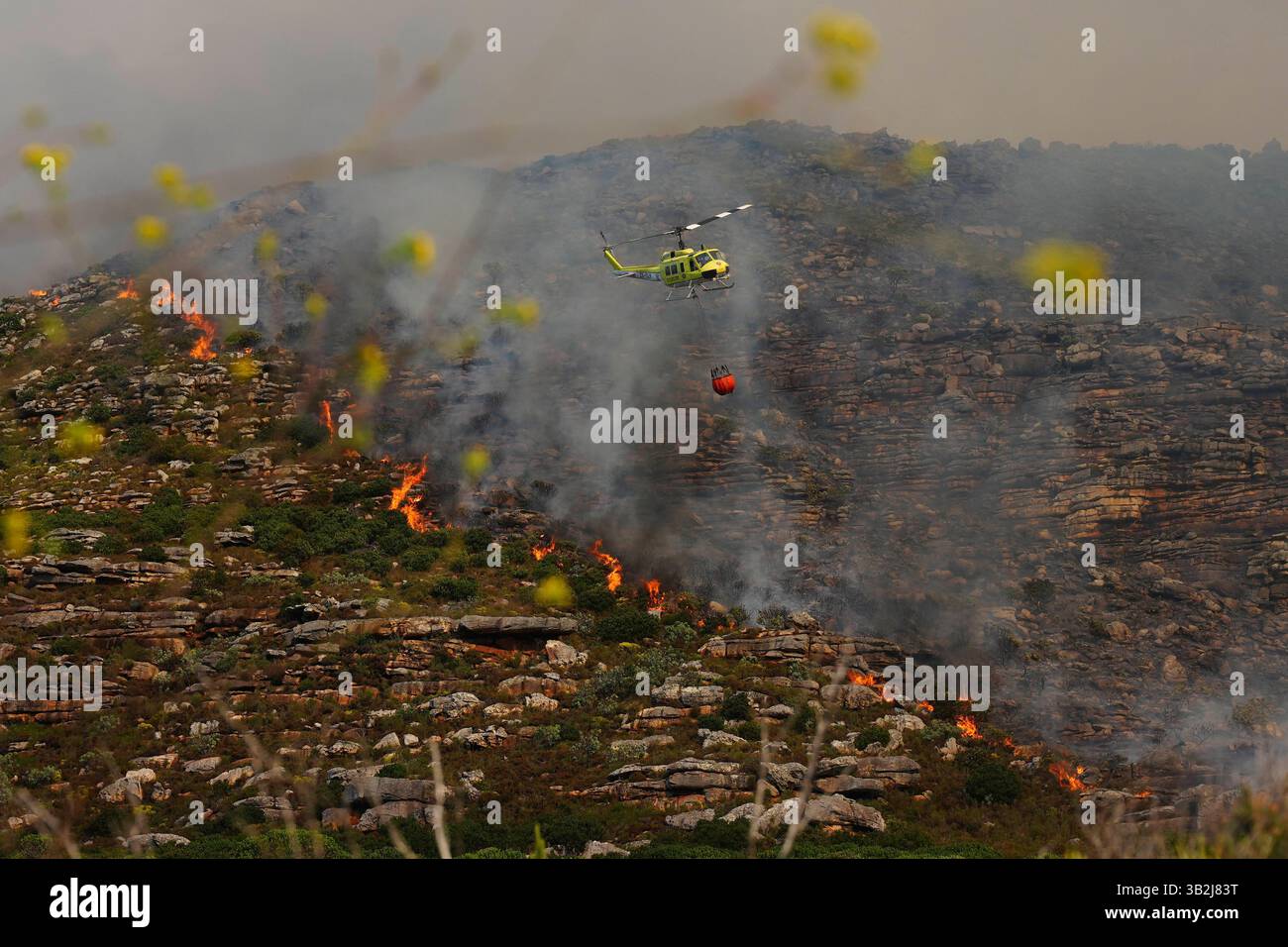 Fire in Cape Town, South Africa A helicopter battles a vegetation fire ...