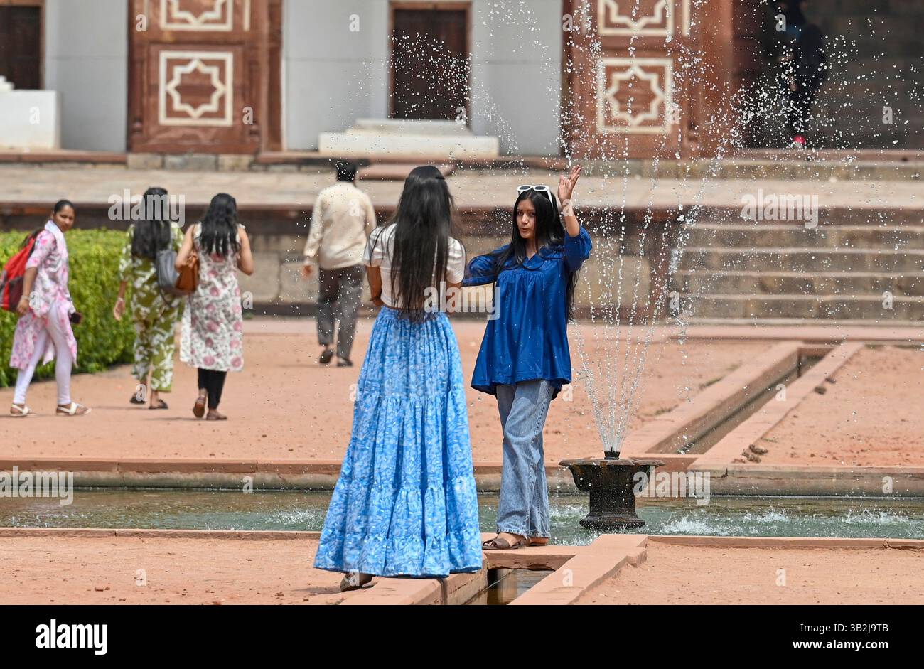 NEW DELHI, INDIA - APRIL 26: Visitors brave the heat wave during a hot ...