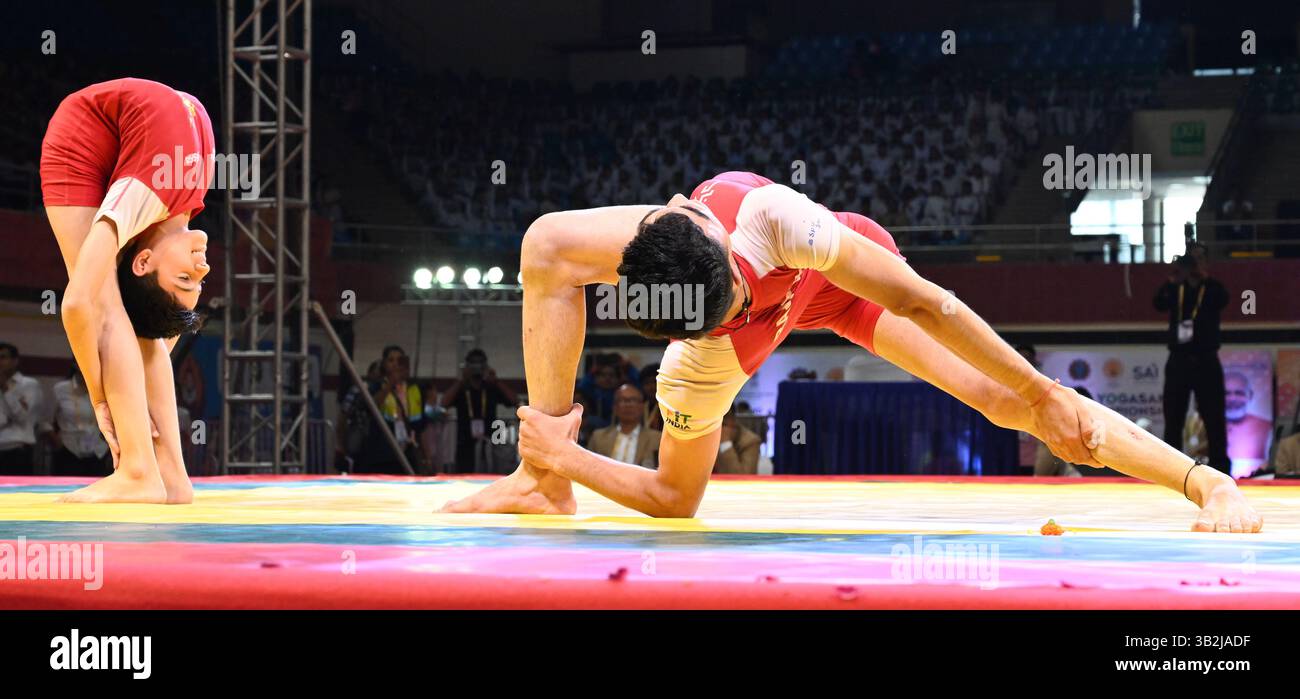 NEW DELHI, INDIA - APRIL 26: Participants perform yoga during the 2nd ...