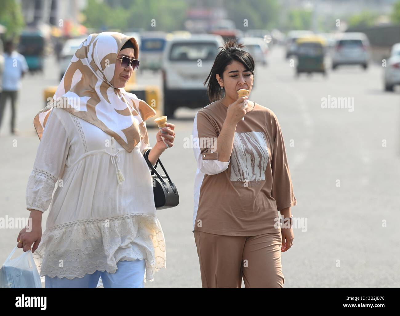 NOIDA, INDIA - APRIL 27: As temperatures rise in Delhi-NCR, commuters ...