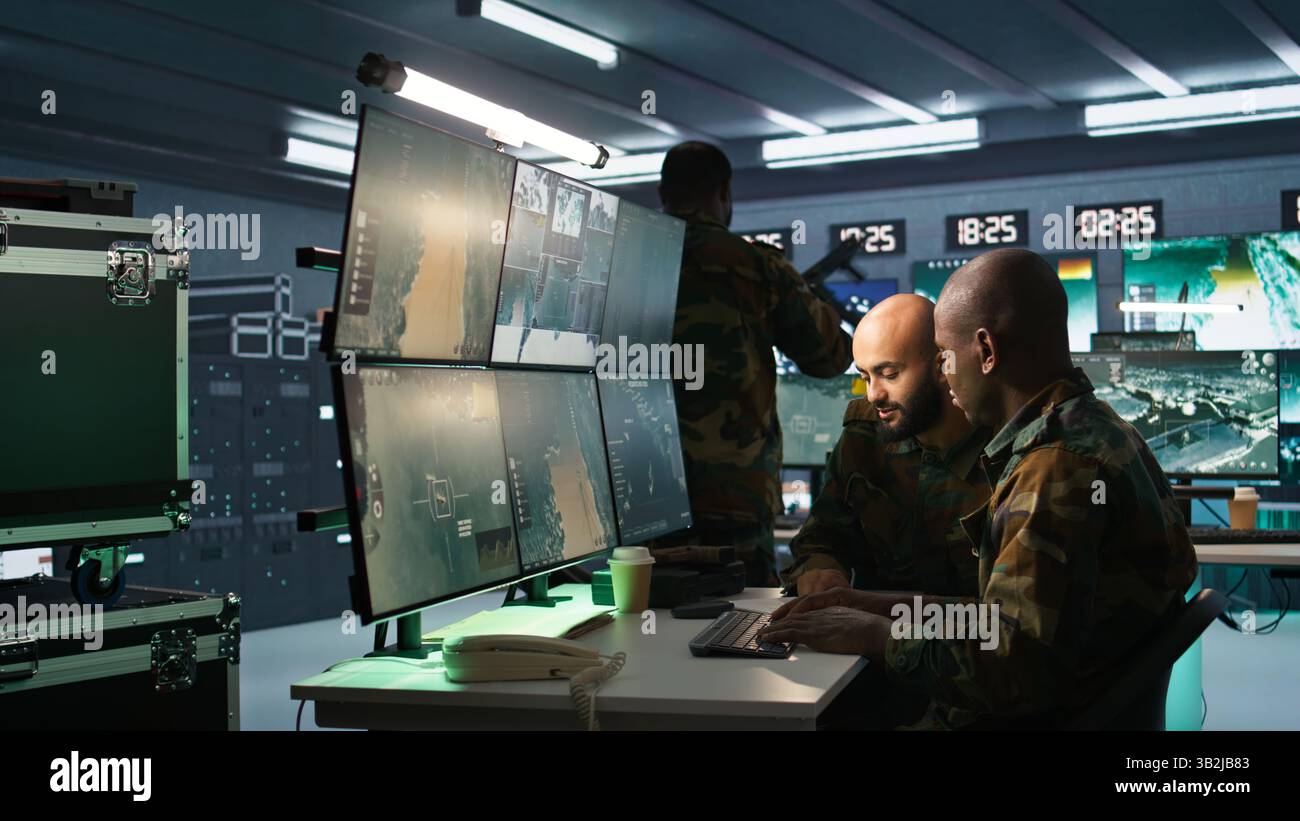 Air force officer and coworker talking while performing tactical level ...
