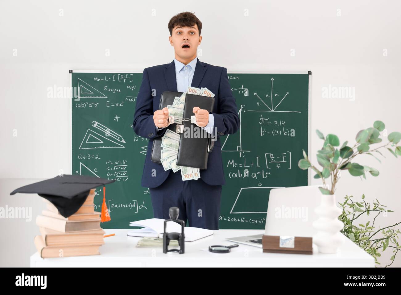 Handcuffed male teacher with briefcase and bribe in classroom ...