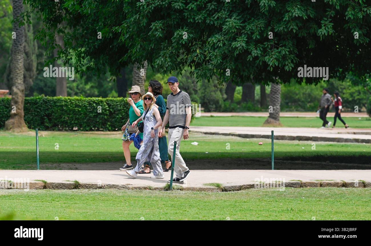 NEW DELHI, INDIA - APRIL 26: Visitors brave the heat wave during a hot ...