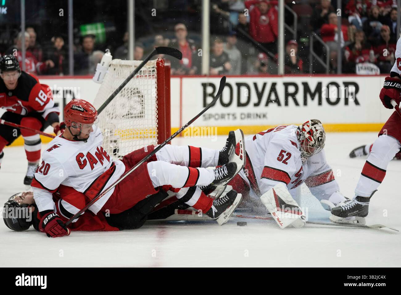 Carolina Hurricanes goaltender Pyotr Kochetkov, right, makes a save as ...