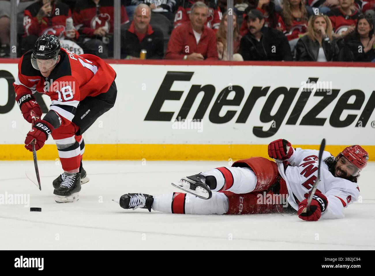 New Jersey Devils' Ondrej Palat, left, moves past Carolina Hurricanes ...