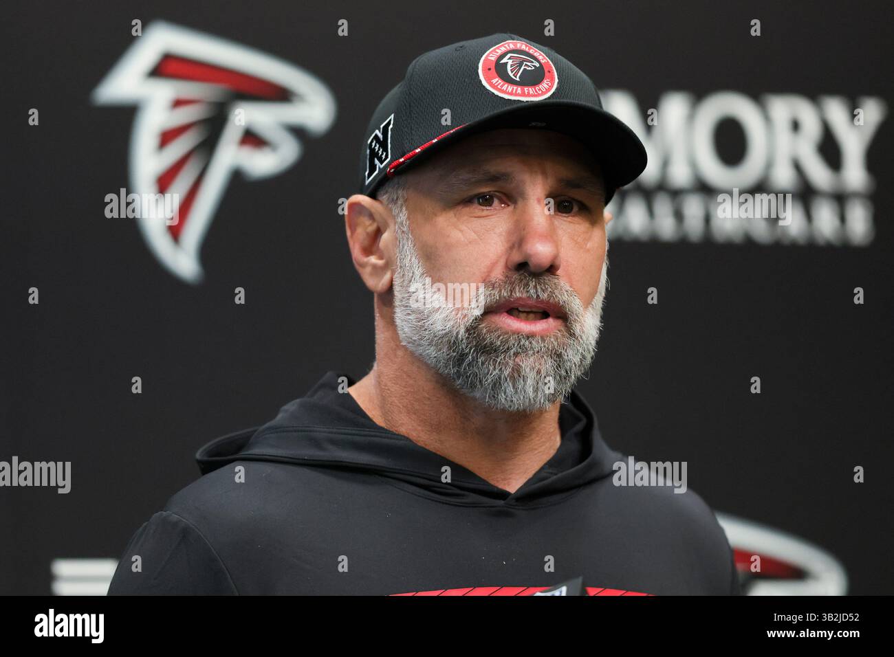 FILE - Atlanta Falcons defensive coordinator Jeff Ulbrich speaks with ...