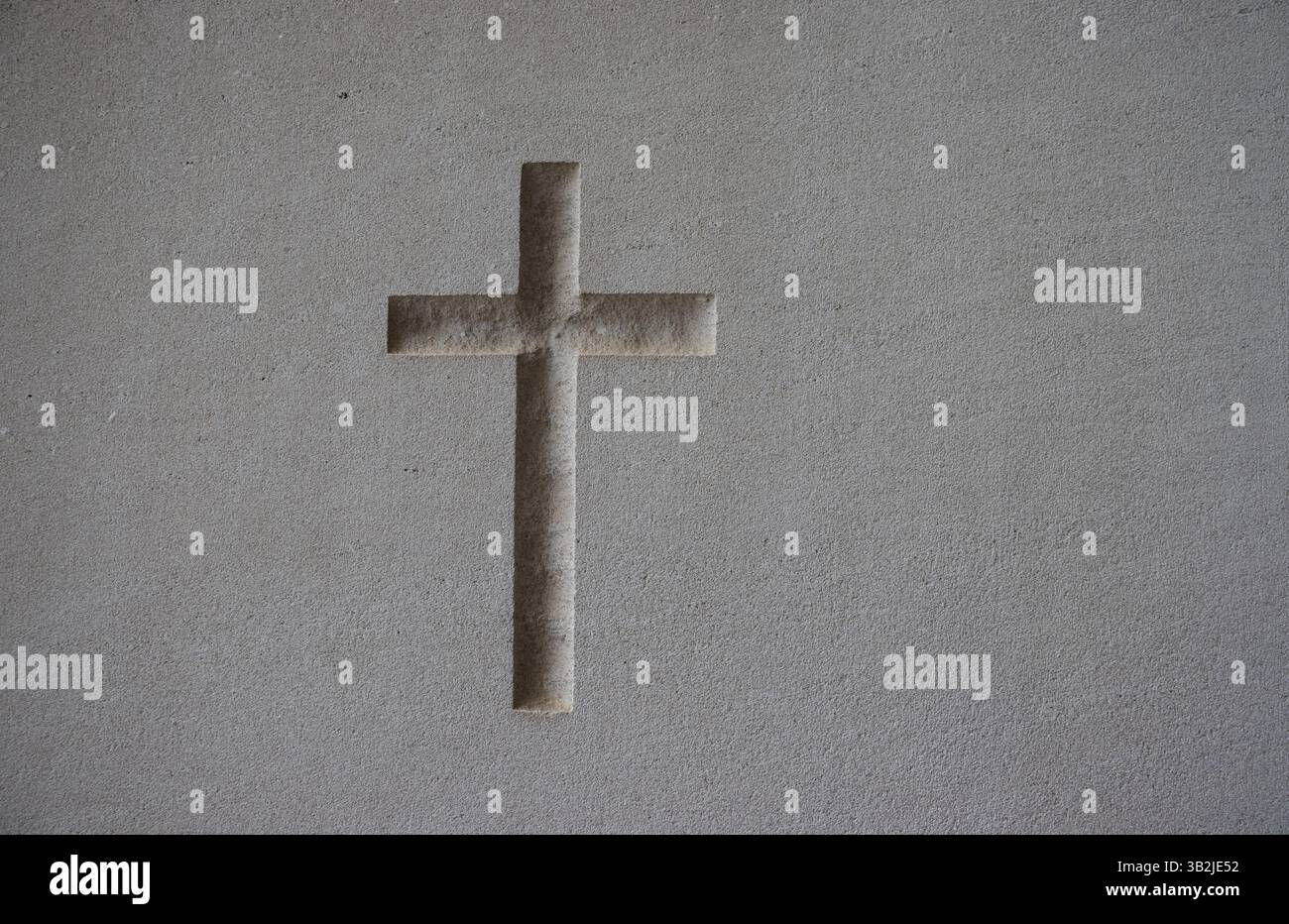 Cross carved in stone on an exterior wall of St. Cecilia Cathedral in ...