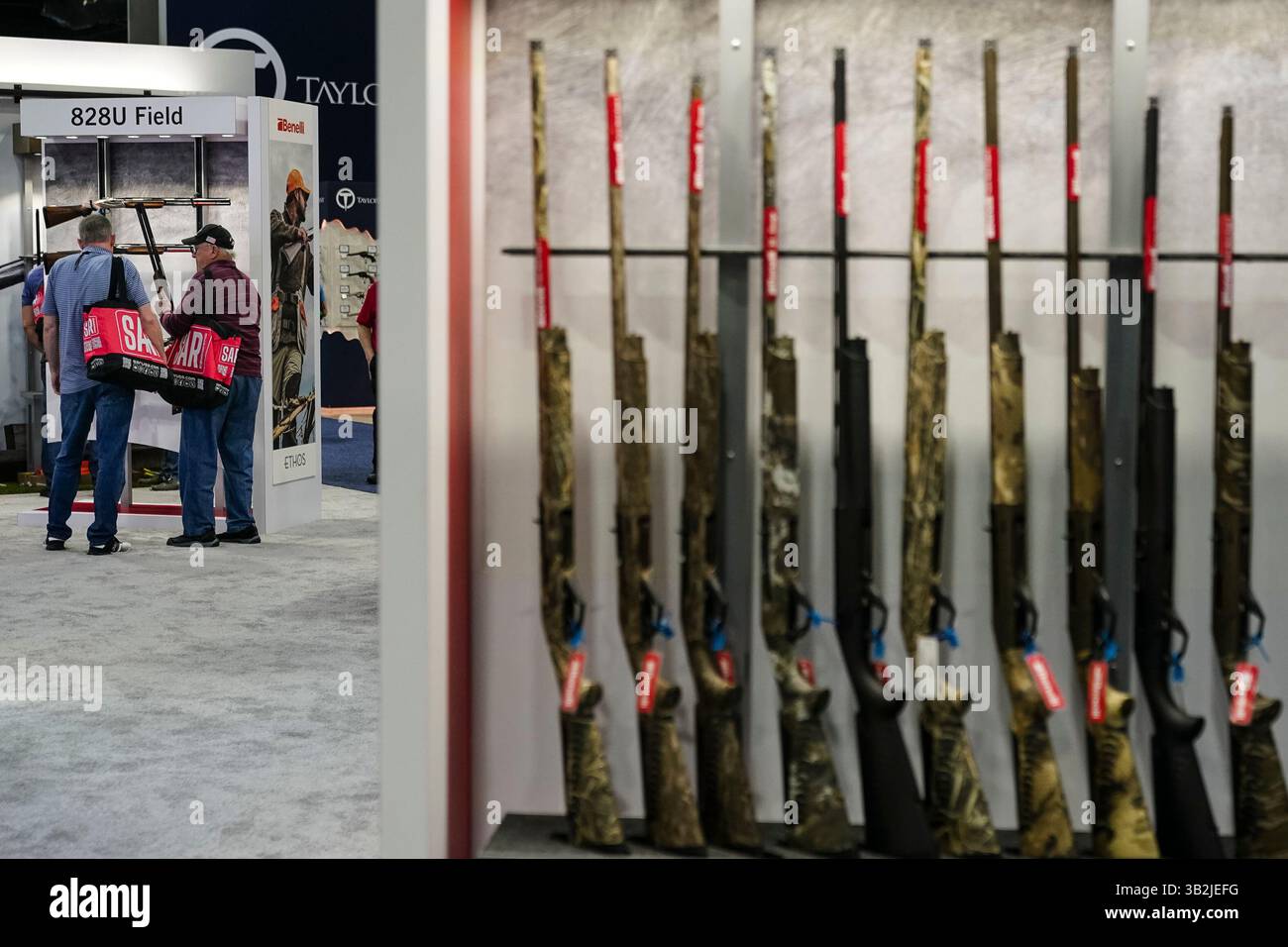 Atlanta, USA. 27th Apr, 2025. A man holds a Benelli 12-gauge shotgun at ...