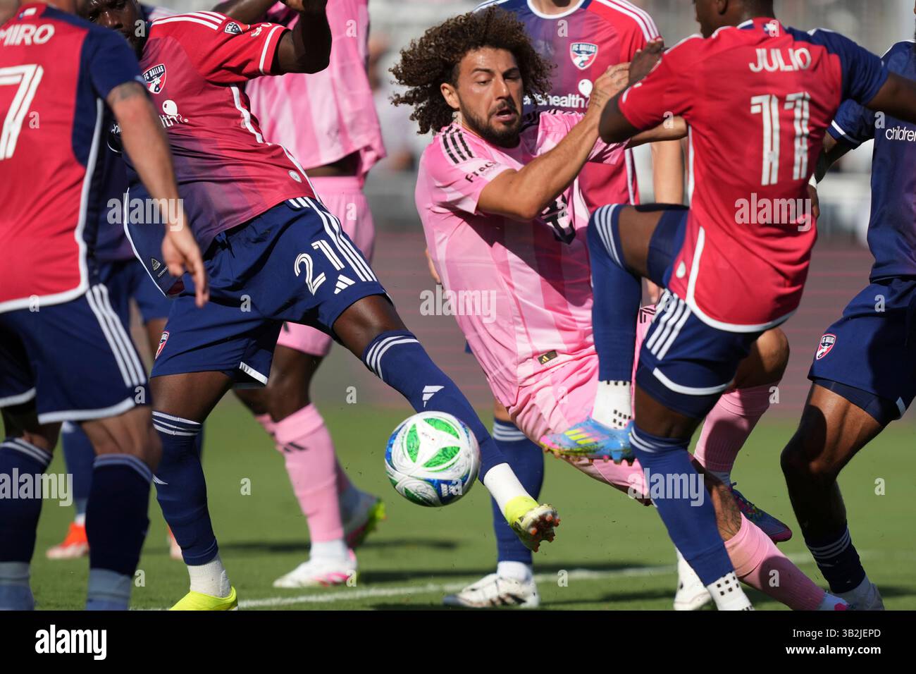 Inter Miami defender Maximiliano Falcón, center, falls as FC Dallas ...