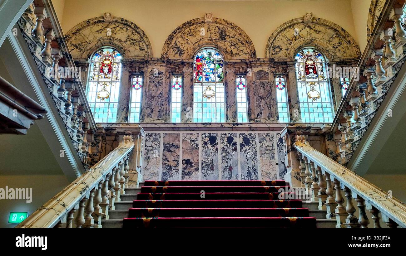 The main staircase, finished in select Italian marble, leading up past ...