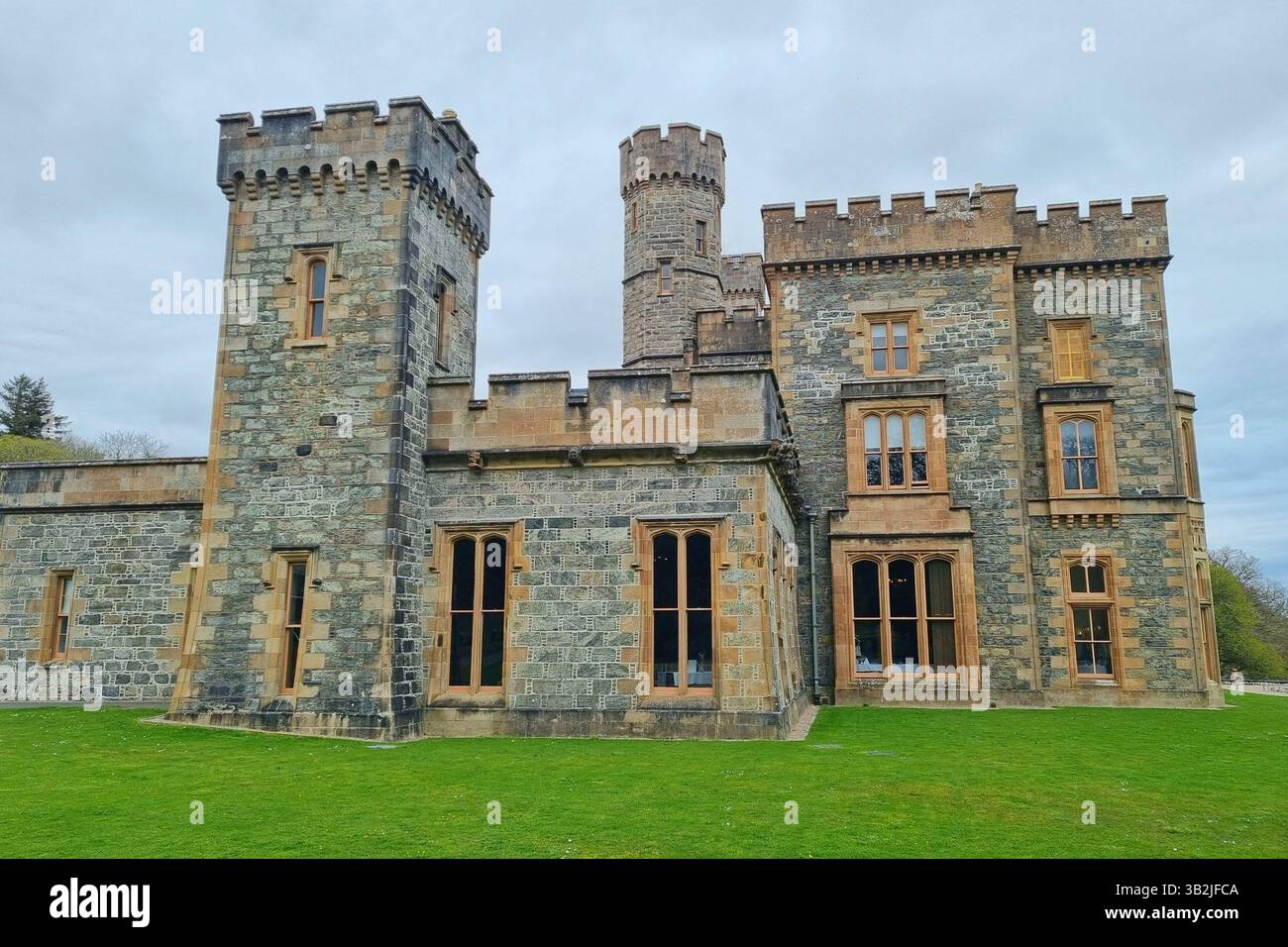 Ancient neo-Gothic Lews Castle from Victorian era on a green lawn in a ...