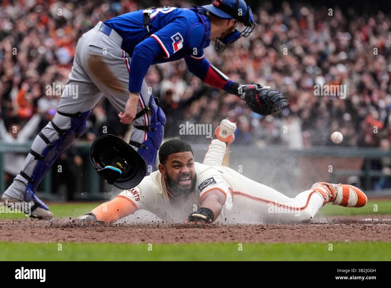 San Francisco Giants' Heliot Ramos scores the game-winning run on a throwing error Texas Rangers ...
