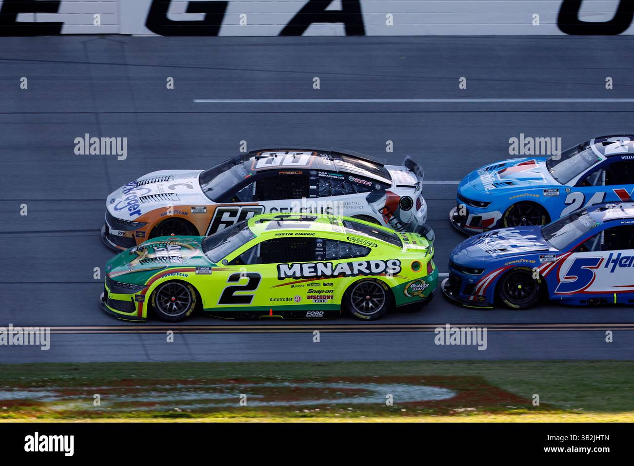 NASCAR Cup Series driver Austin Cindric (2) beats driver Ryan Preece ...